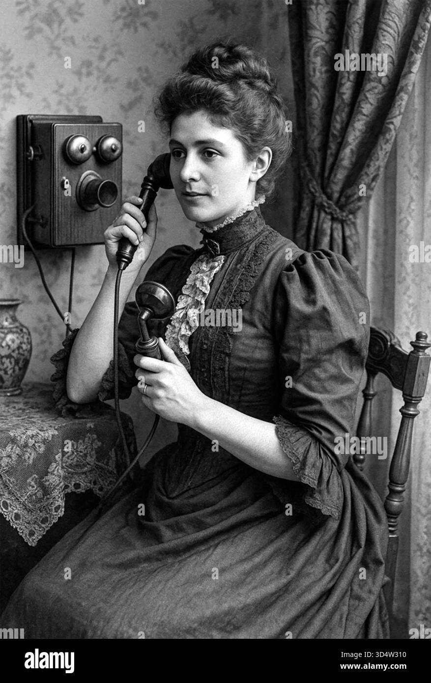 A GEC wall mounted telephone in use about 1890 Stock Photo - Alamy