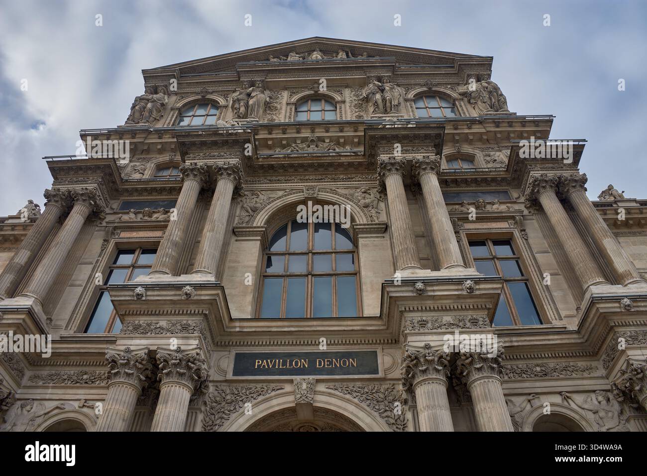 The facade of the Louvre Museum commands attention with its classical ...
