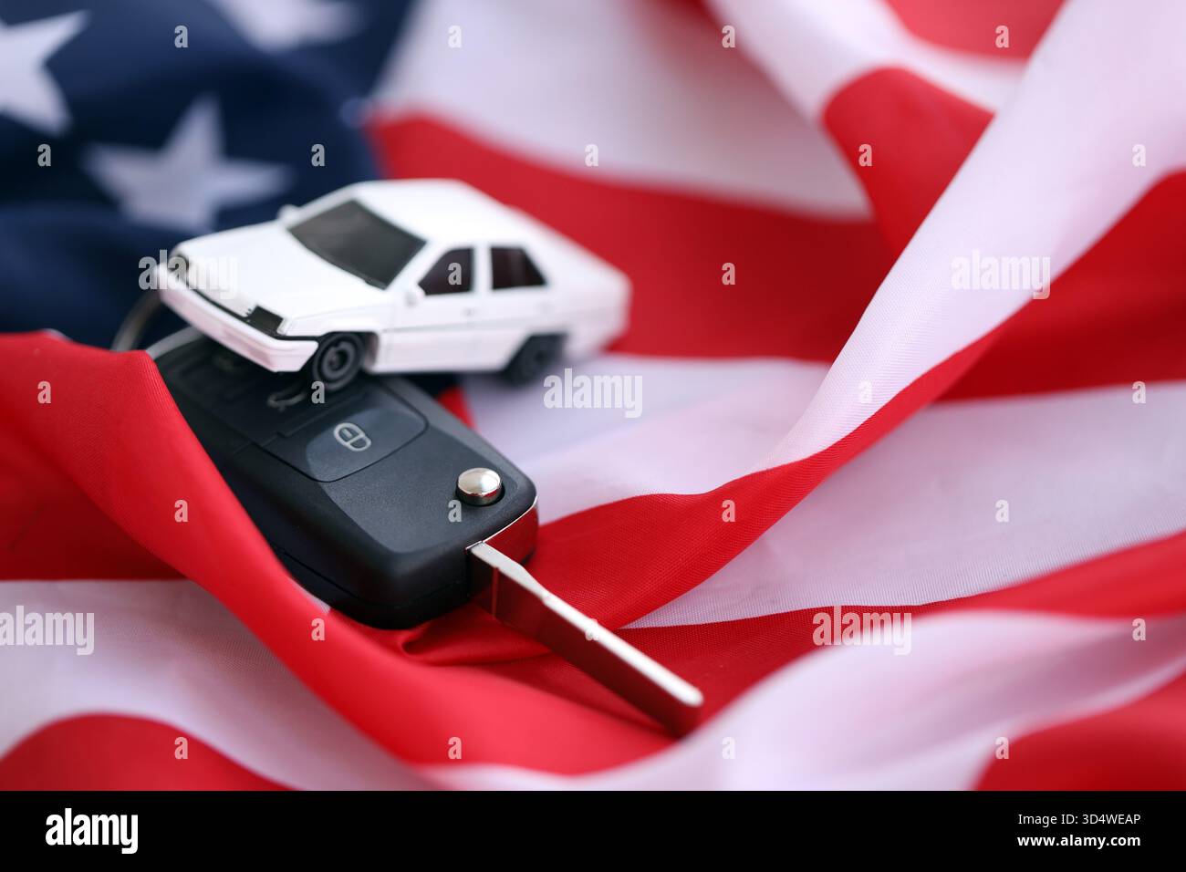 Ignition keys with remote control buttons and toy car on United States ...