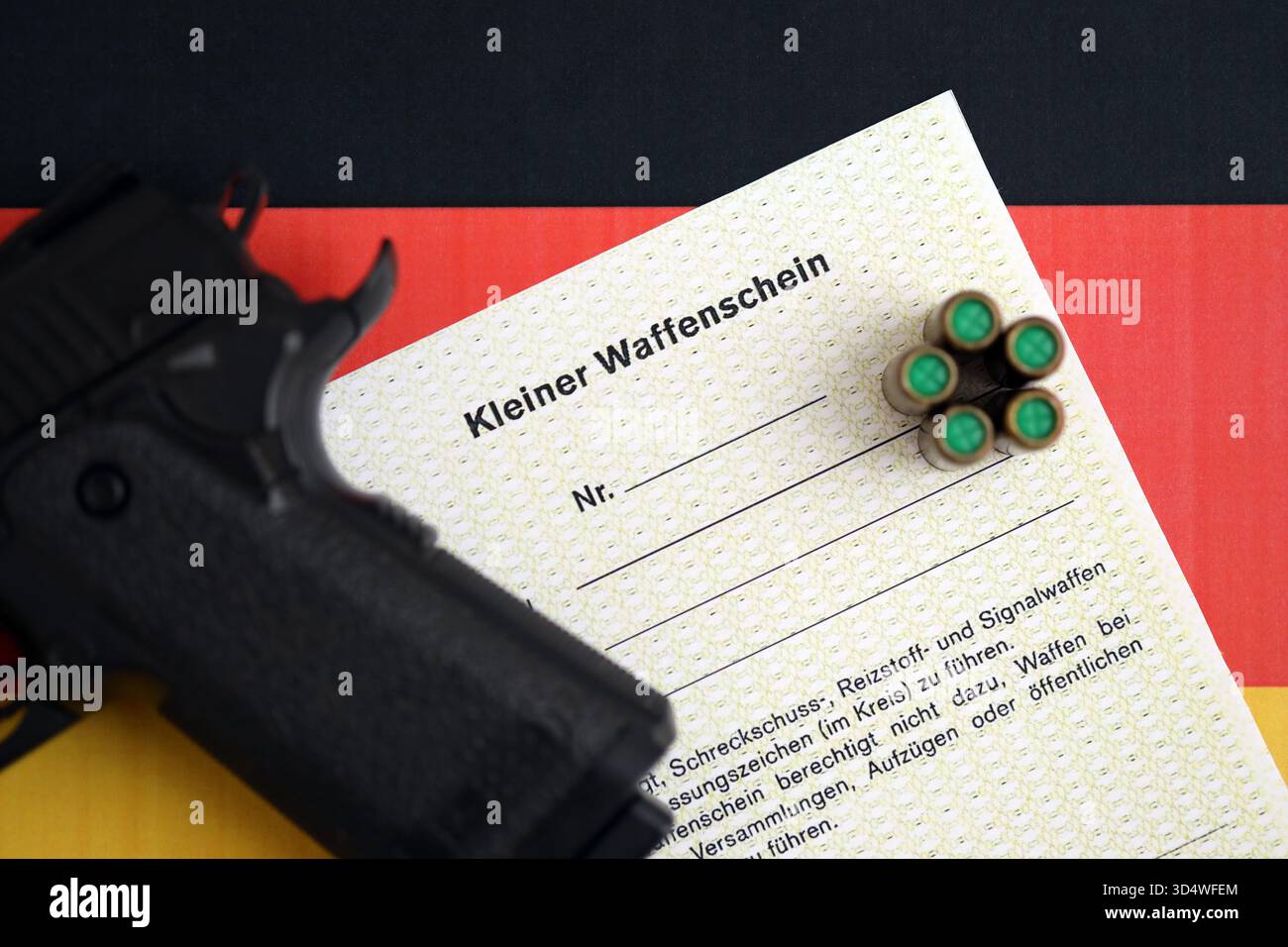 German light firearms license and handgun with bullets on Germany flag ...