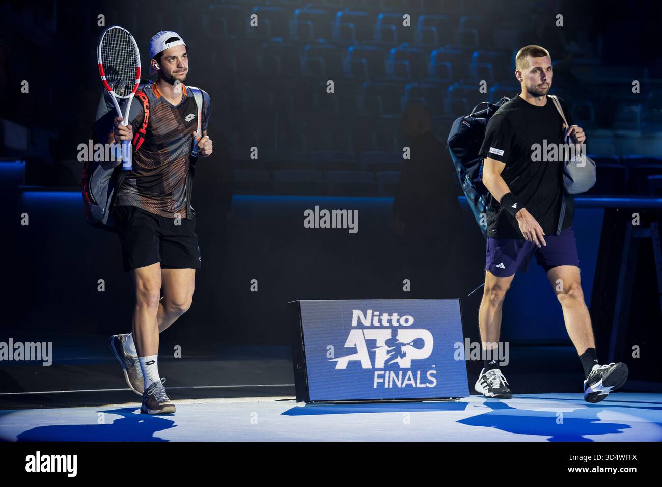 Julian Cash (L) and Lloyd Glasspool of Great Britain walk out prior to ...