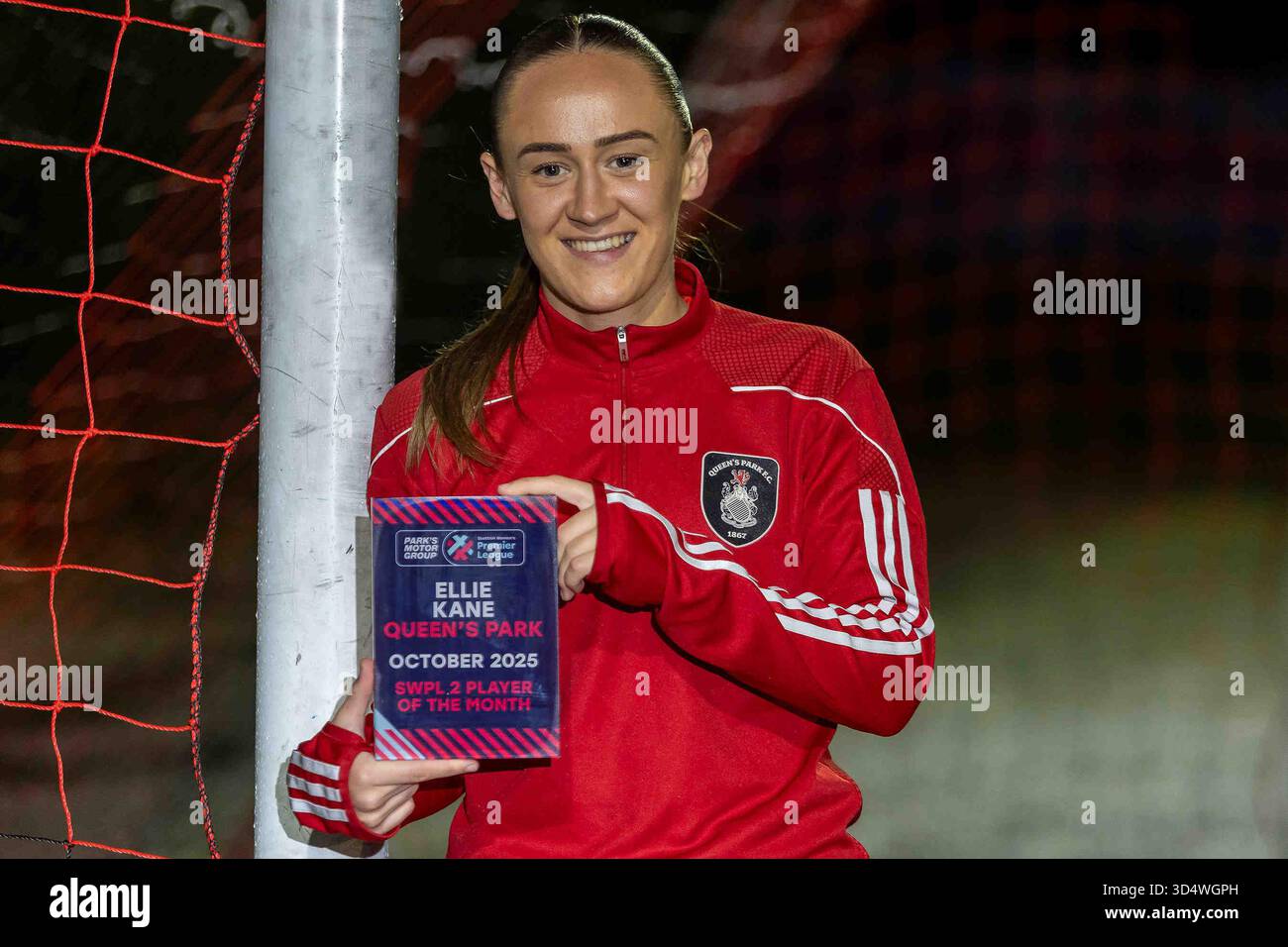 Springburn, Glasgow, Scotland. 11 November 2025. Ellie Kane of Queens Park FC accepts the Parks ...