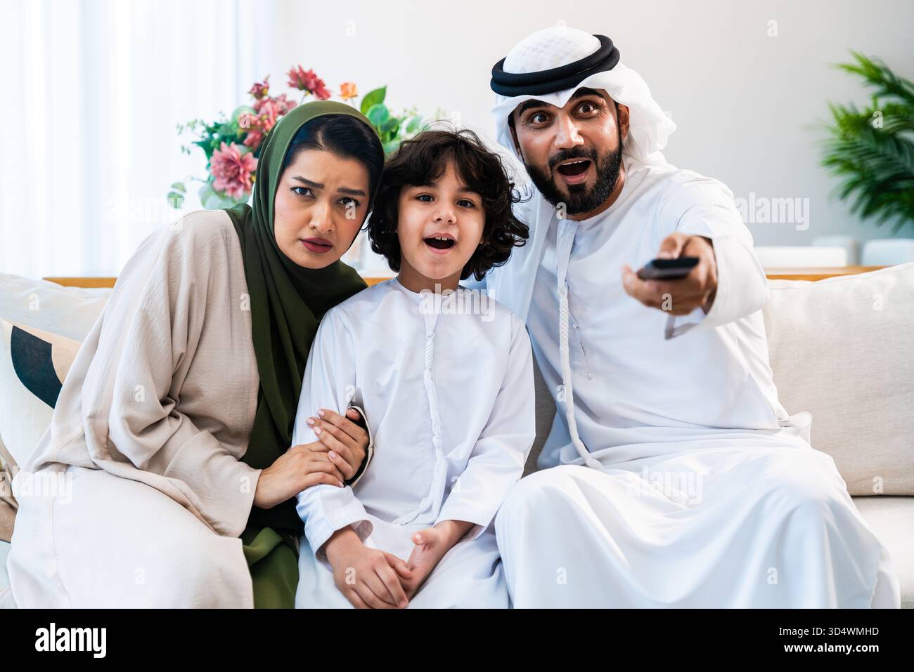 Emirati family watching hi-res stock photography and images - Alamy