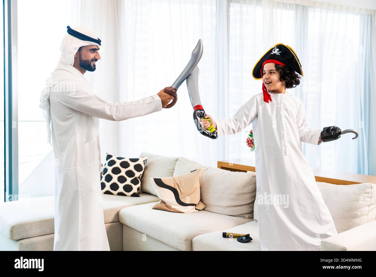 Middle-eastern family wearing traditional emirati clothing spending ...