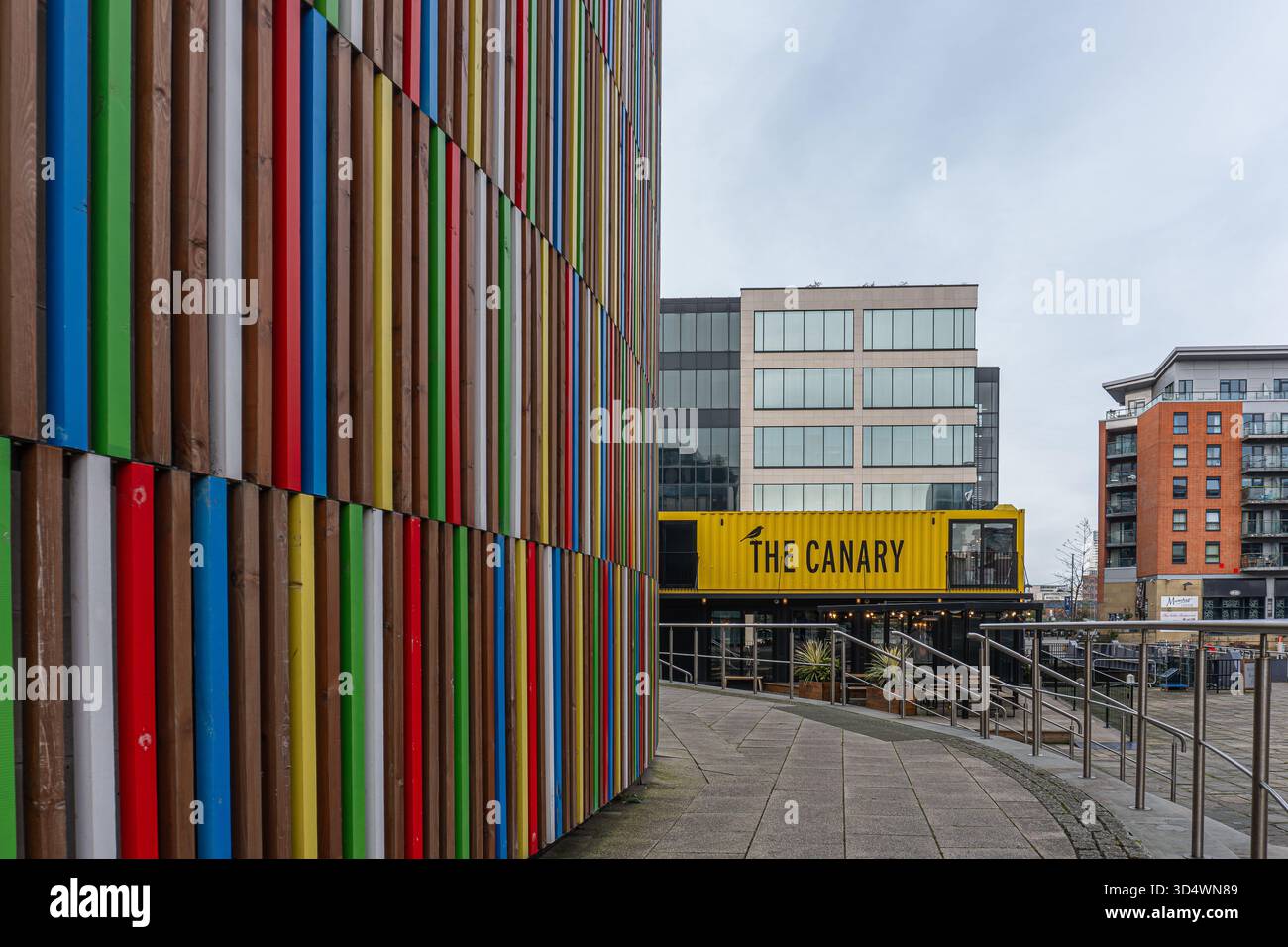 Chromatic Facade: The Canary and the Curve Stock Photo - Alamy
