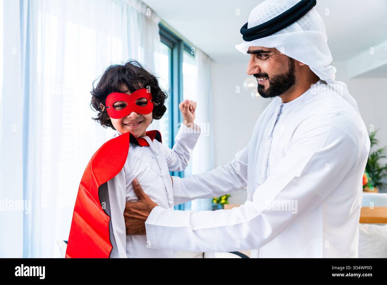 Middle-eastern family wearing traditional emirati clothing spending ...