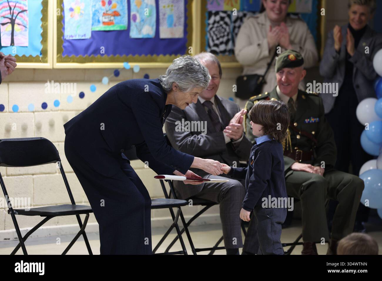 President Catherine Connolly meeting pupils during a visit to Gaelscoil ...