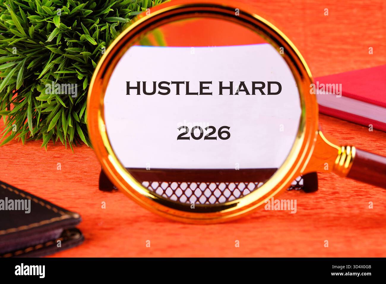 A magnifying glass focuses on a message about putting in hard work ...