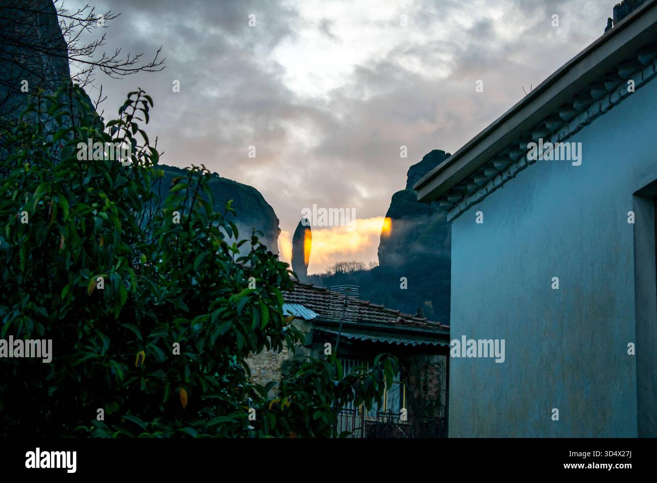 The peaks of rocks in Greece shrouded in mist at dawn Stock Photo - Alamy