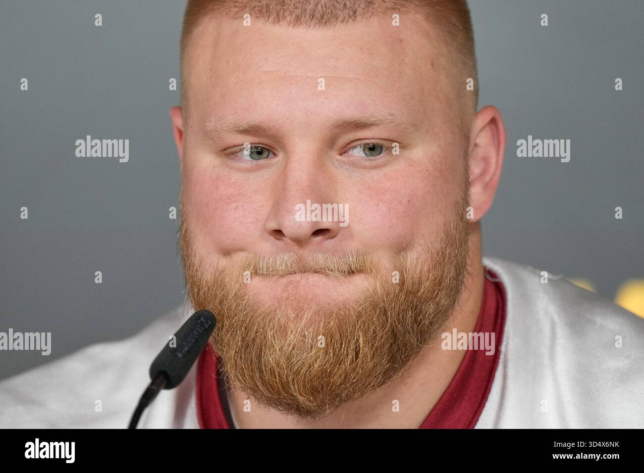 Washington Commanders center Tyler Biadasz (63) attends a press ...