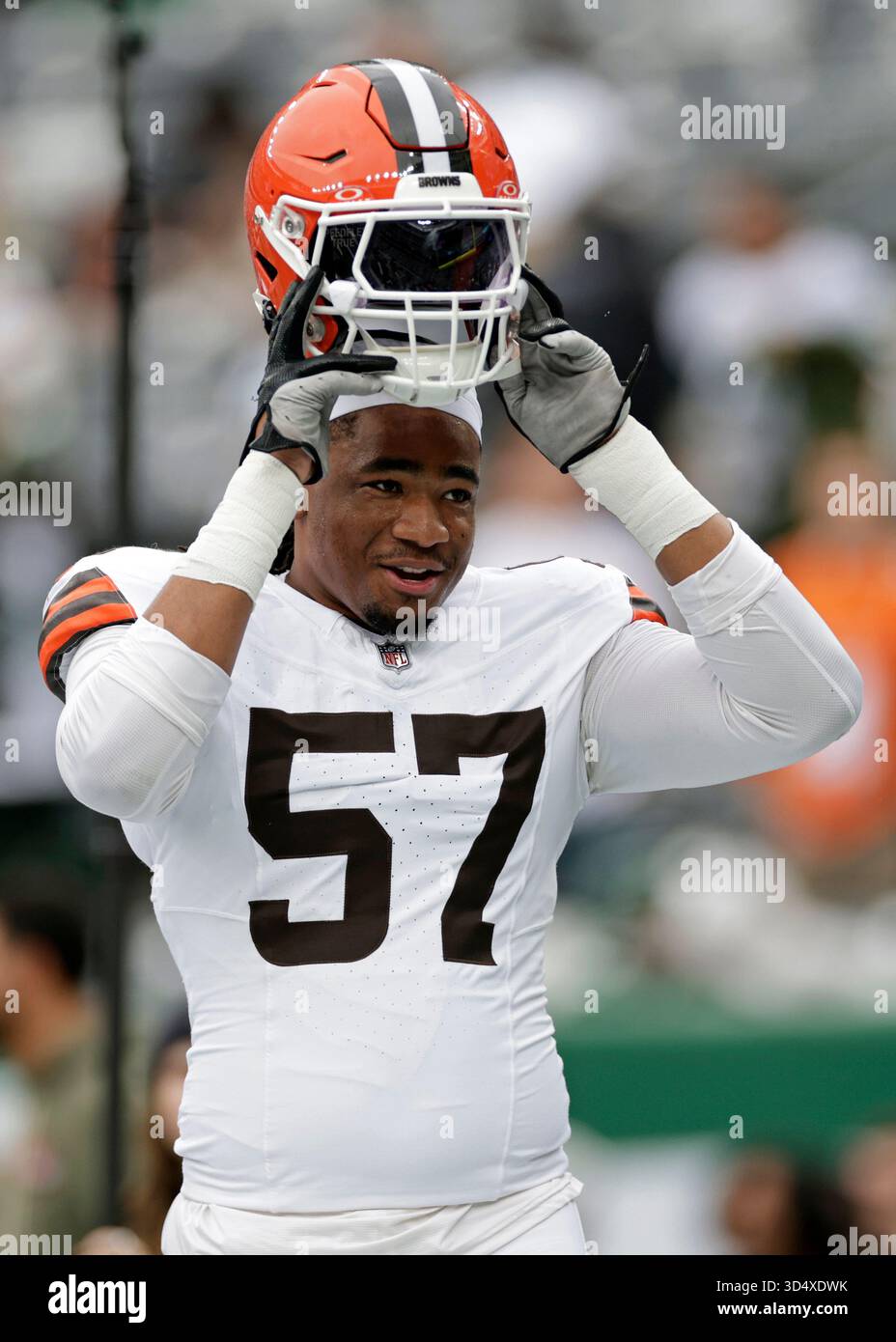 Cleveland Browns defensive end Isaiah McGuire (57) warms up before an ...