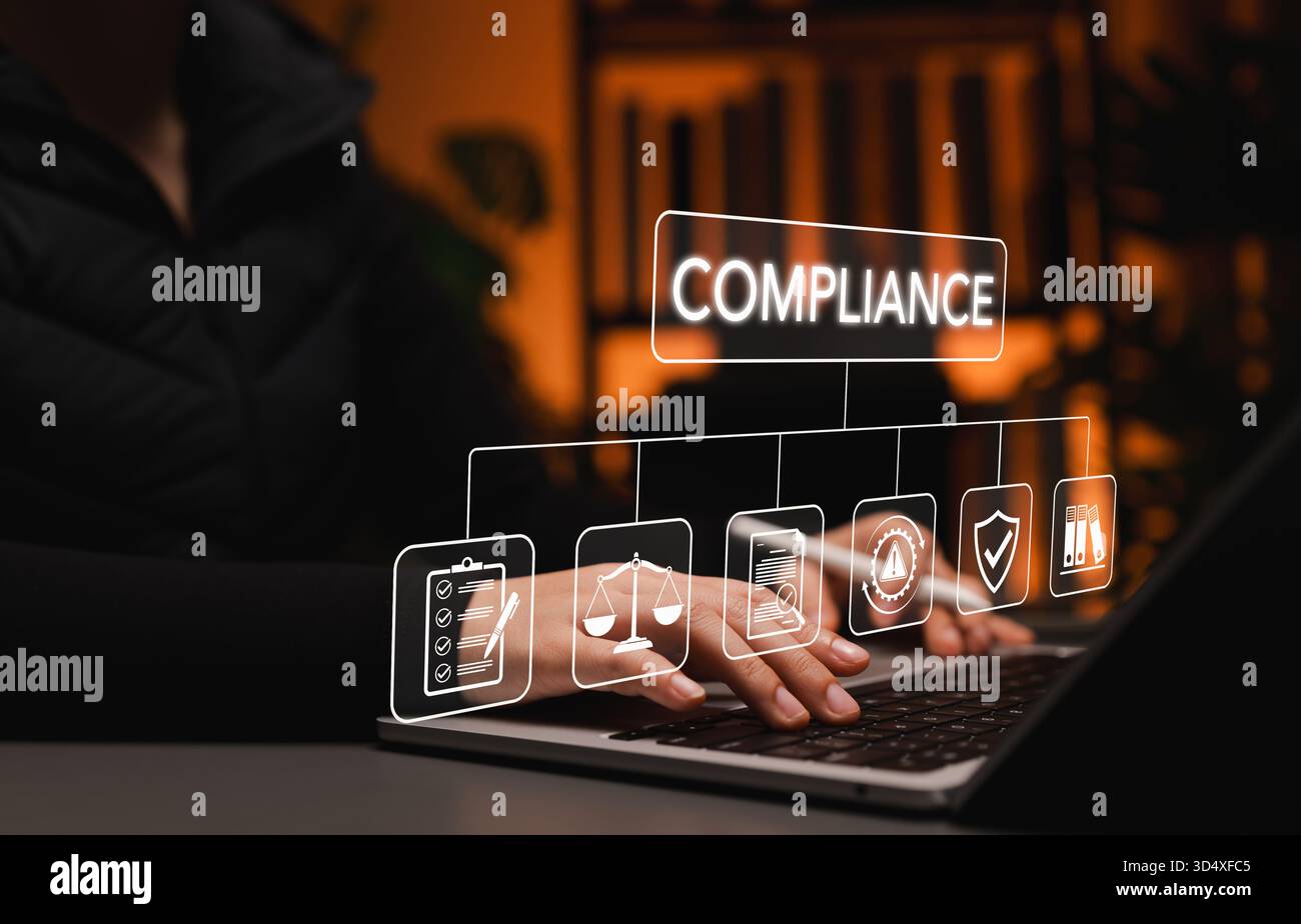 Corporate compliance concept. Person using laptop with icons of ...