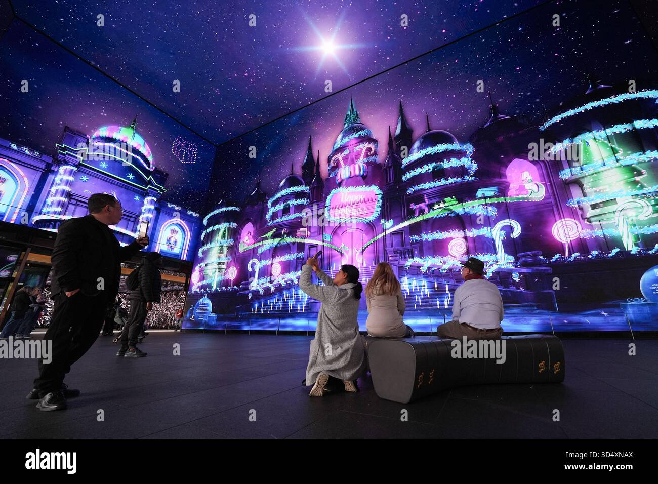 People look at the Ice Palace, a free, immersive experience which takes ...