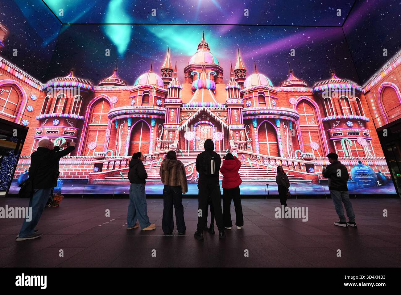 People look at the Ice Palace, a free, immersive experience which takes ...