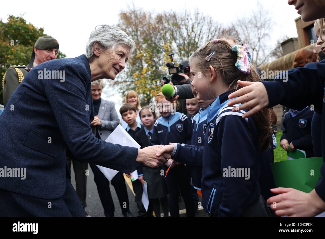 President Catherine Connolly meeting pupils during a visit to Gaelscoil ...