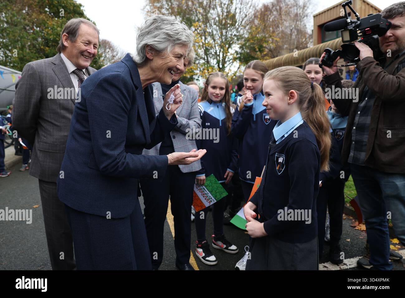 President Catherine Connolly meeting pupils during a visit to Gaelscoil ...