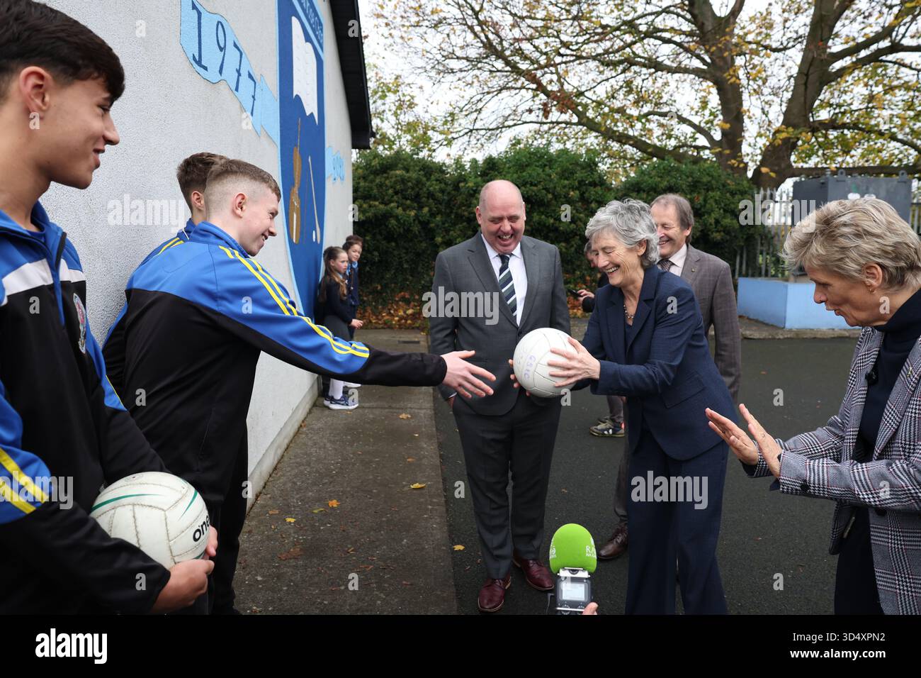 President Catherine Connolly with pupils during a visit to Gaelscoil ...
