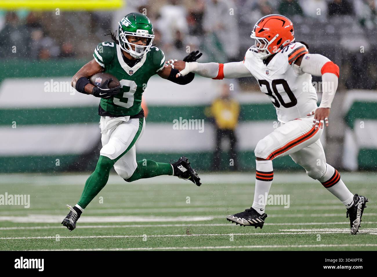 New York Jets Wide Receiver John Metchie III (3) runs with the ball ...
