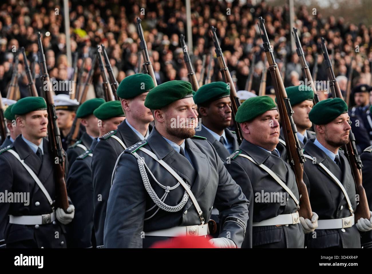 Soldiers take part in the ceremonial pledge as a central event to mark ...