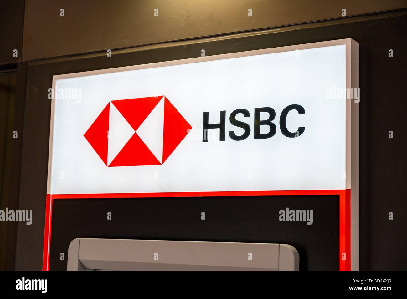 Illuminated HSBC bank sign above automated teller machine, San ...