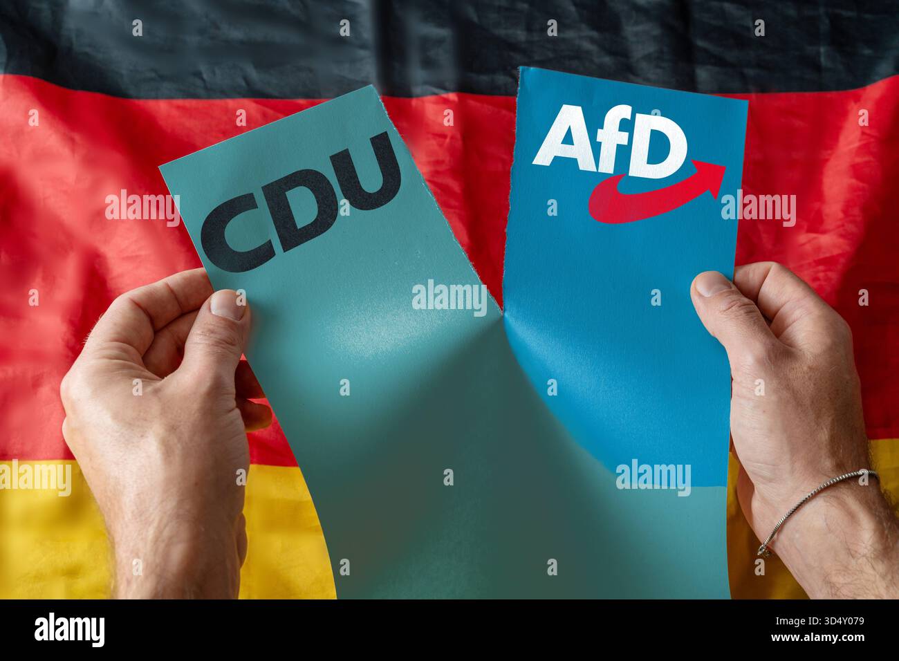 Bavaria, Germany - November 10, 2025: PHOTO MONTAGE, Two hands hold ...