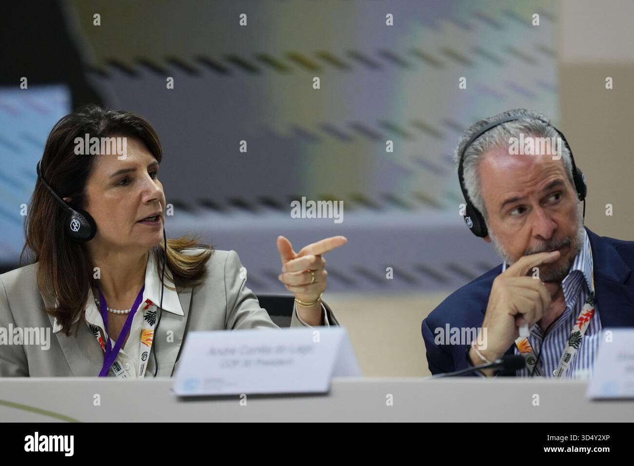 Ana Toni, COP30 CEO, left, speaks during a news conference next to ...