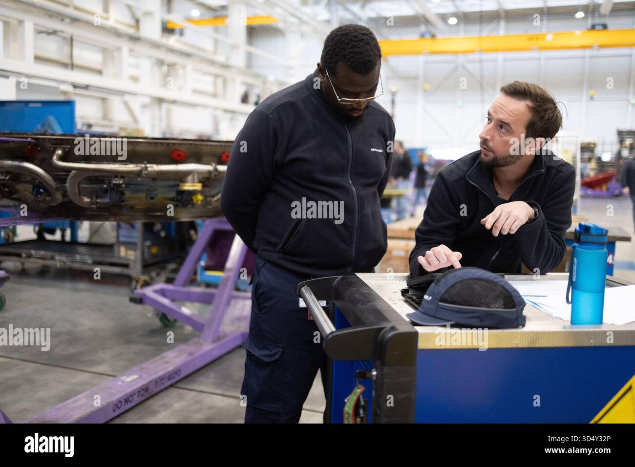 Work-study student and Employees work on engines at the Air France ...