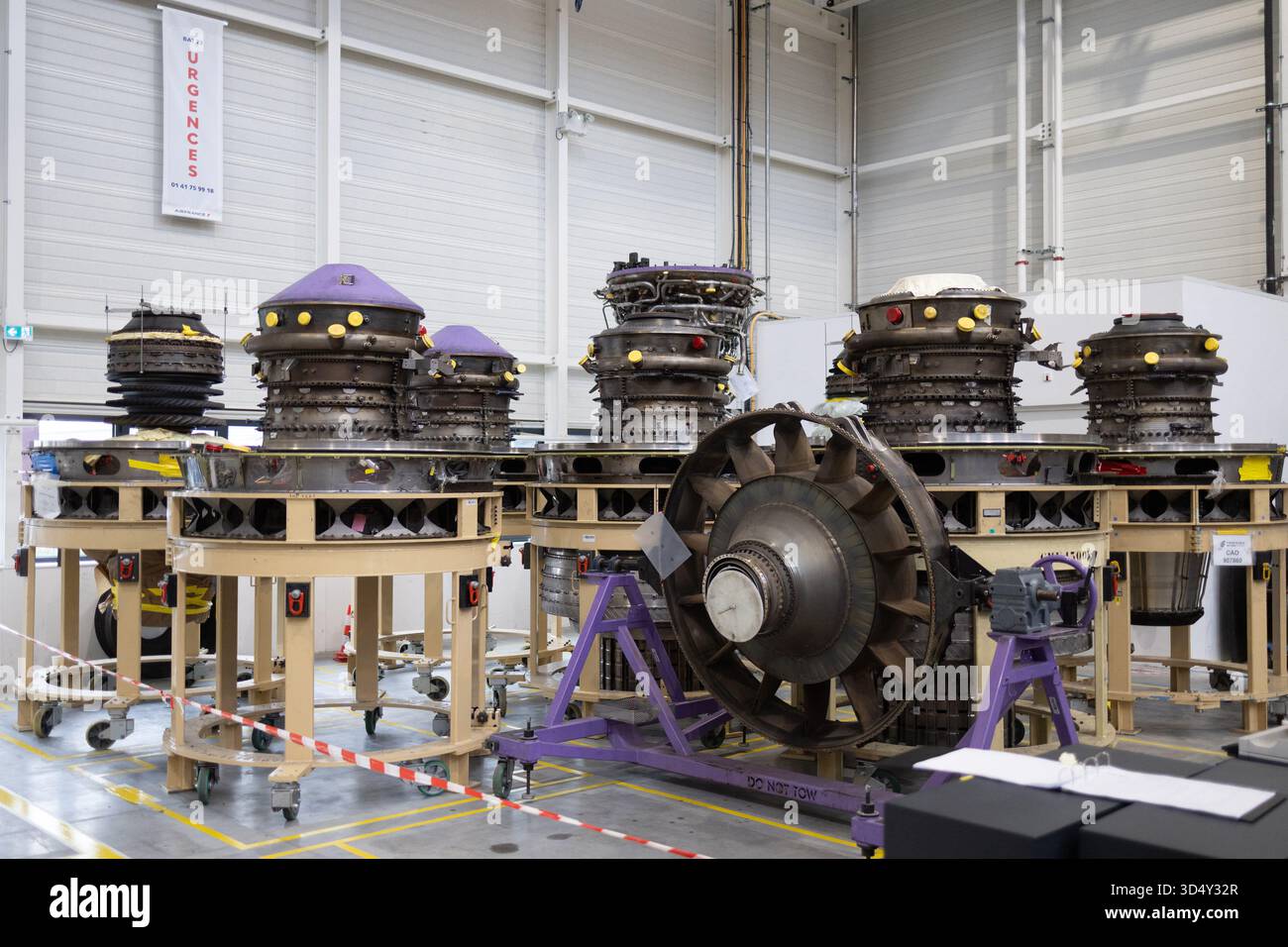 Employees work on engines at the Air France Industries site in Orly ...