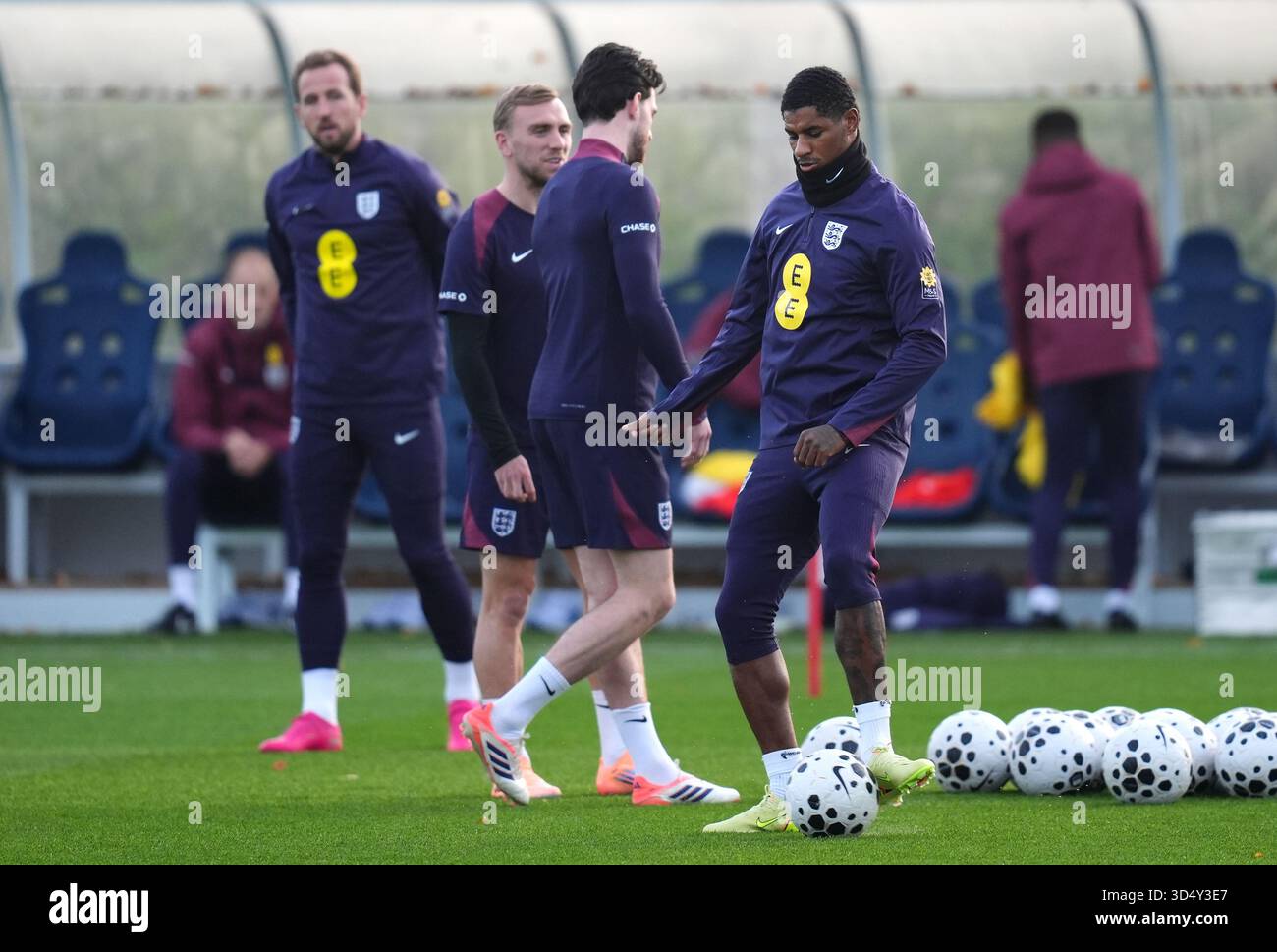 England's Marcus Rashford (right) and team-mates during a training ...