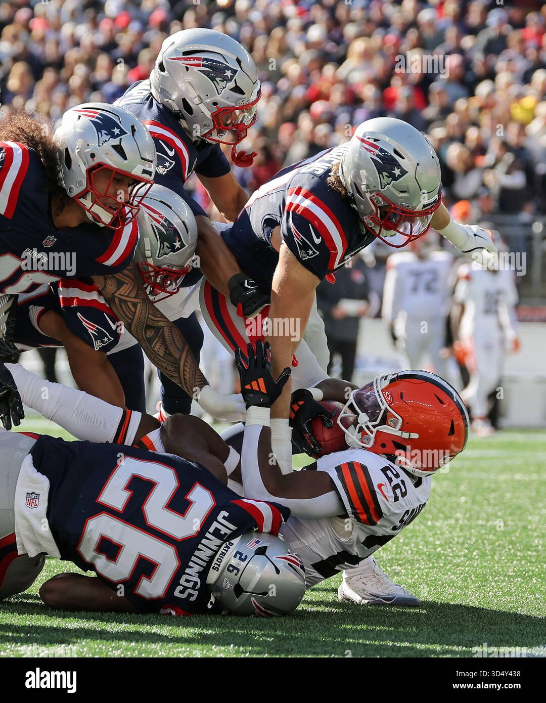 Cleveland Browns running back Dylan Sampson is stopped by New England ...