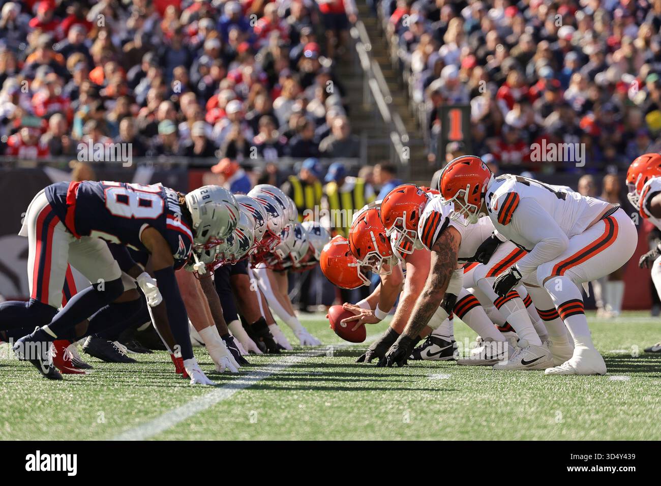 The Cleveland Browns and the New England Patriots line up at the line ...