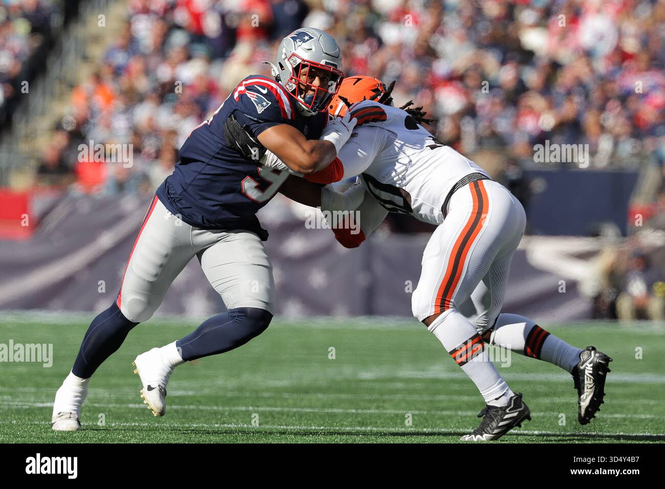 New England Patriots linebacker Elijah Ponder tries to get past a ...