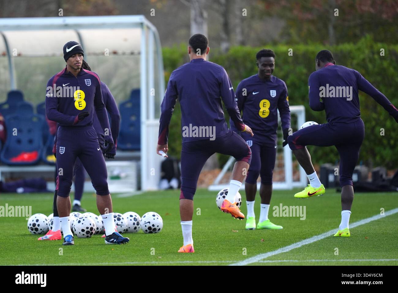 England's Jude Bellingham (left) and team-mates during a training ...