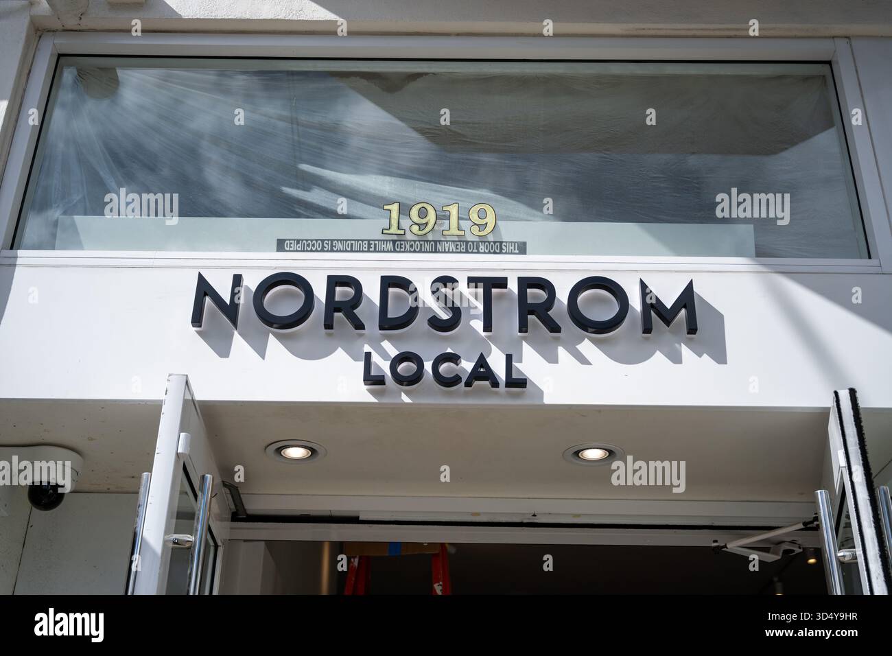 Nordstrom Local storefront entrance with logo signage and transom ...