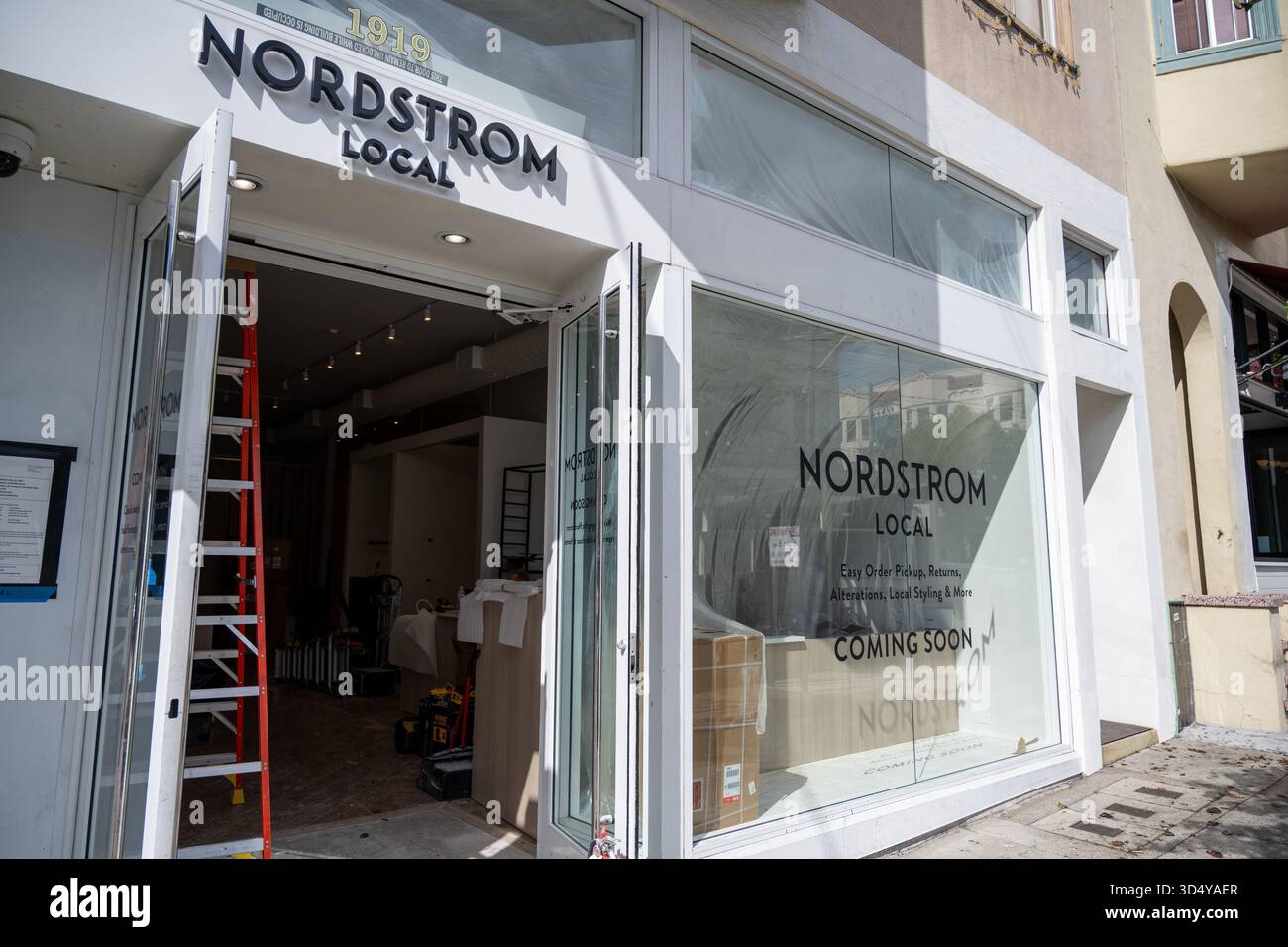 Nordstrom Local storefront under construction with open doors, ladder ...