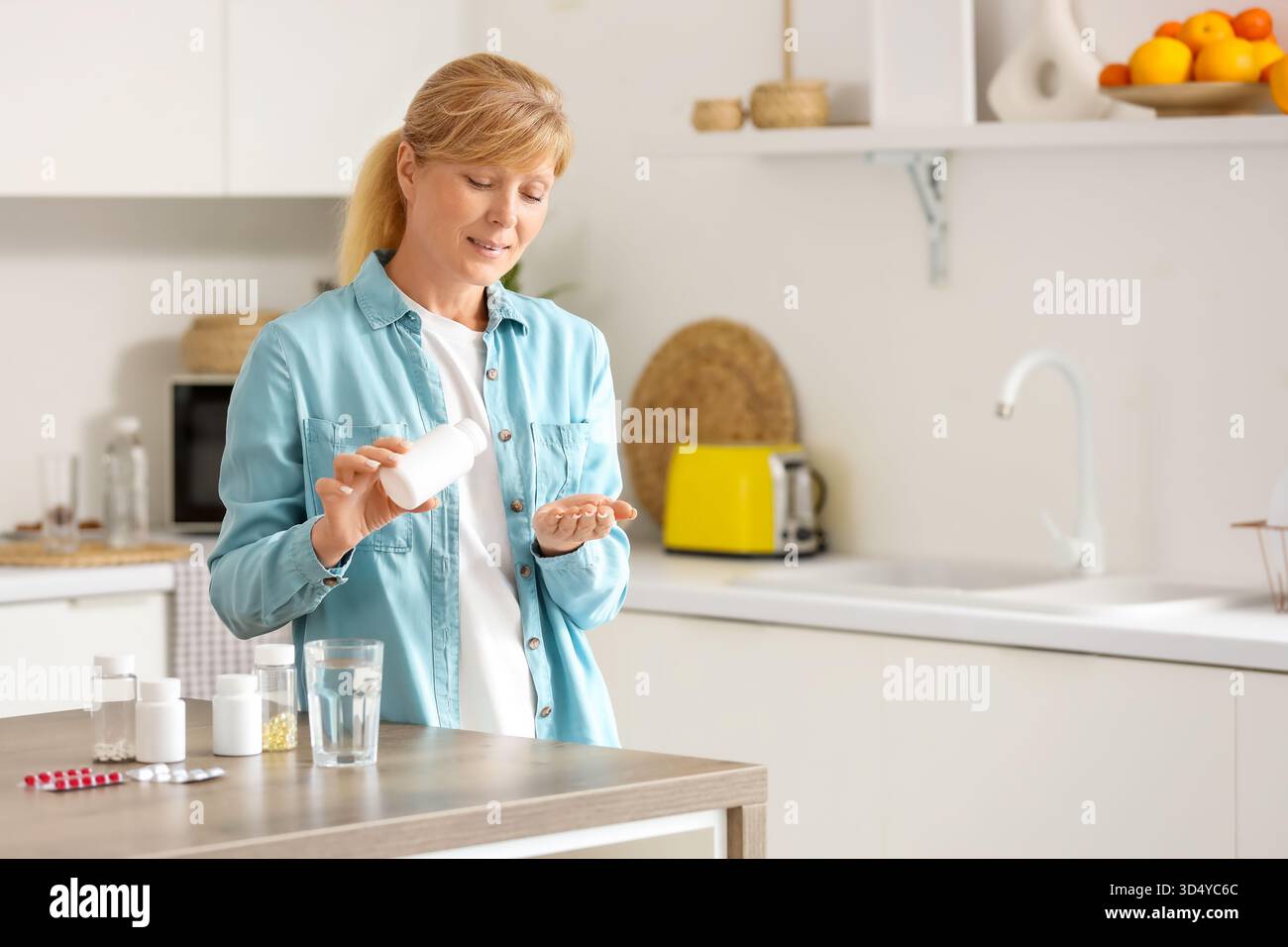 Mature woman vitamin supplements hi-res stock photography and images ...