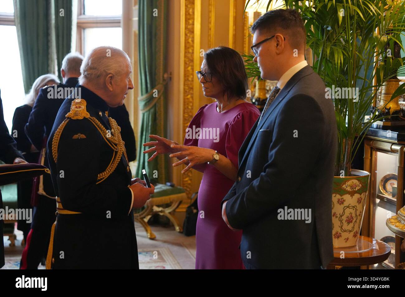 Mrs. Andrea Irvine (Widow) receives the Elizabeth Emblem from King ...