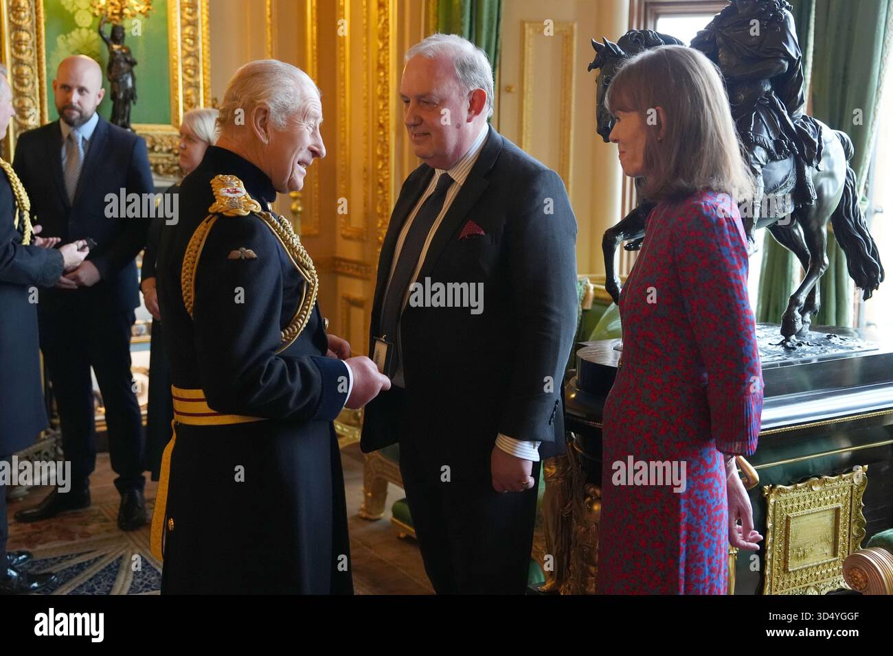 Mr. Andrew Murphy (Son) receives the Elizabeth Emblem from King Charles ...