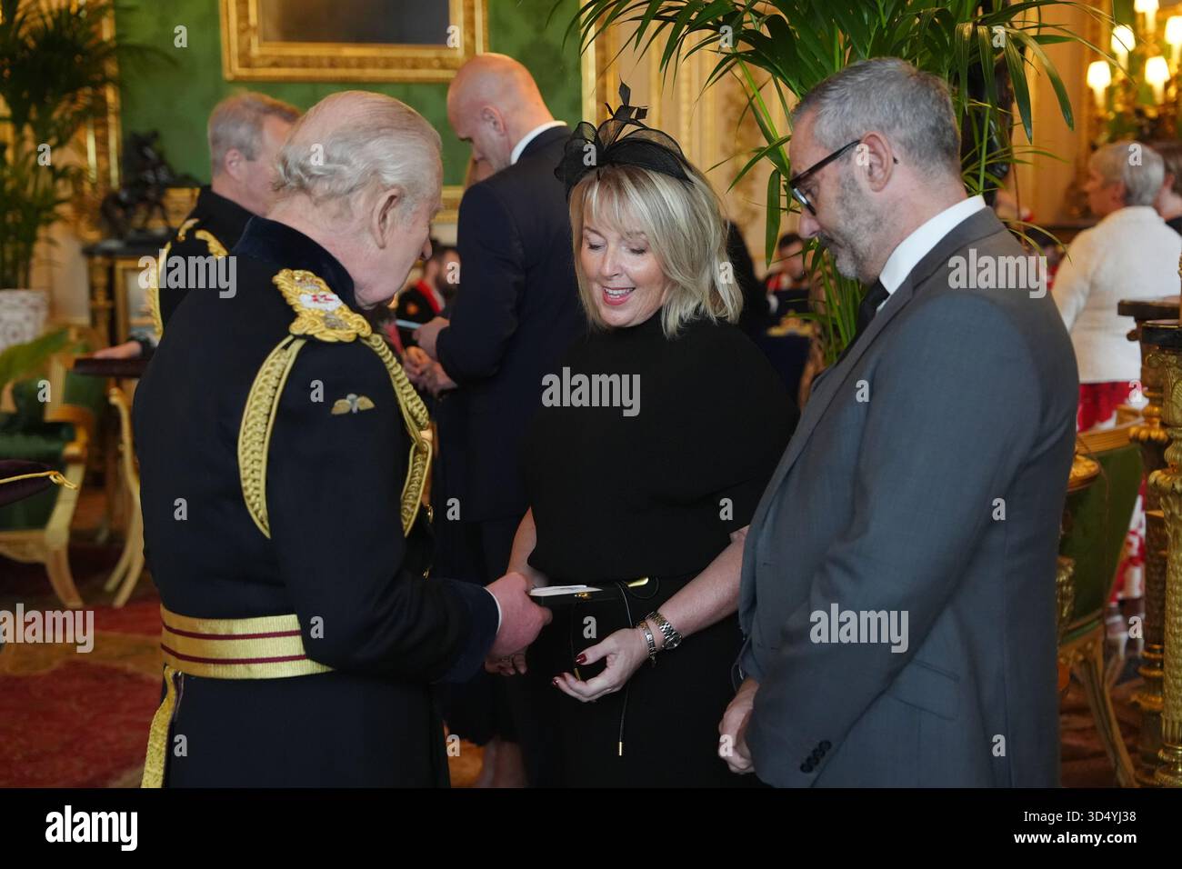 Mrs. Dawn Ferguson (Daughter) receives the Elizabeth Emblem from King ...