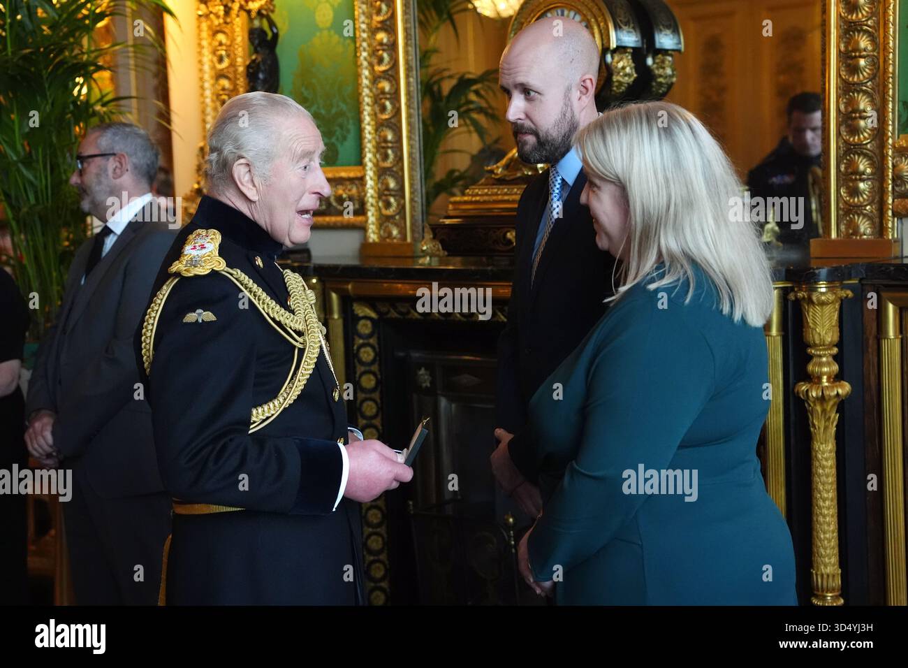 Mr. Stuart Meyer (Son) receives the Elizabeth Emblem from King Charles ...