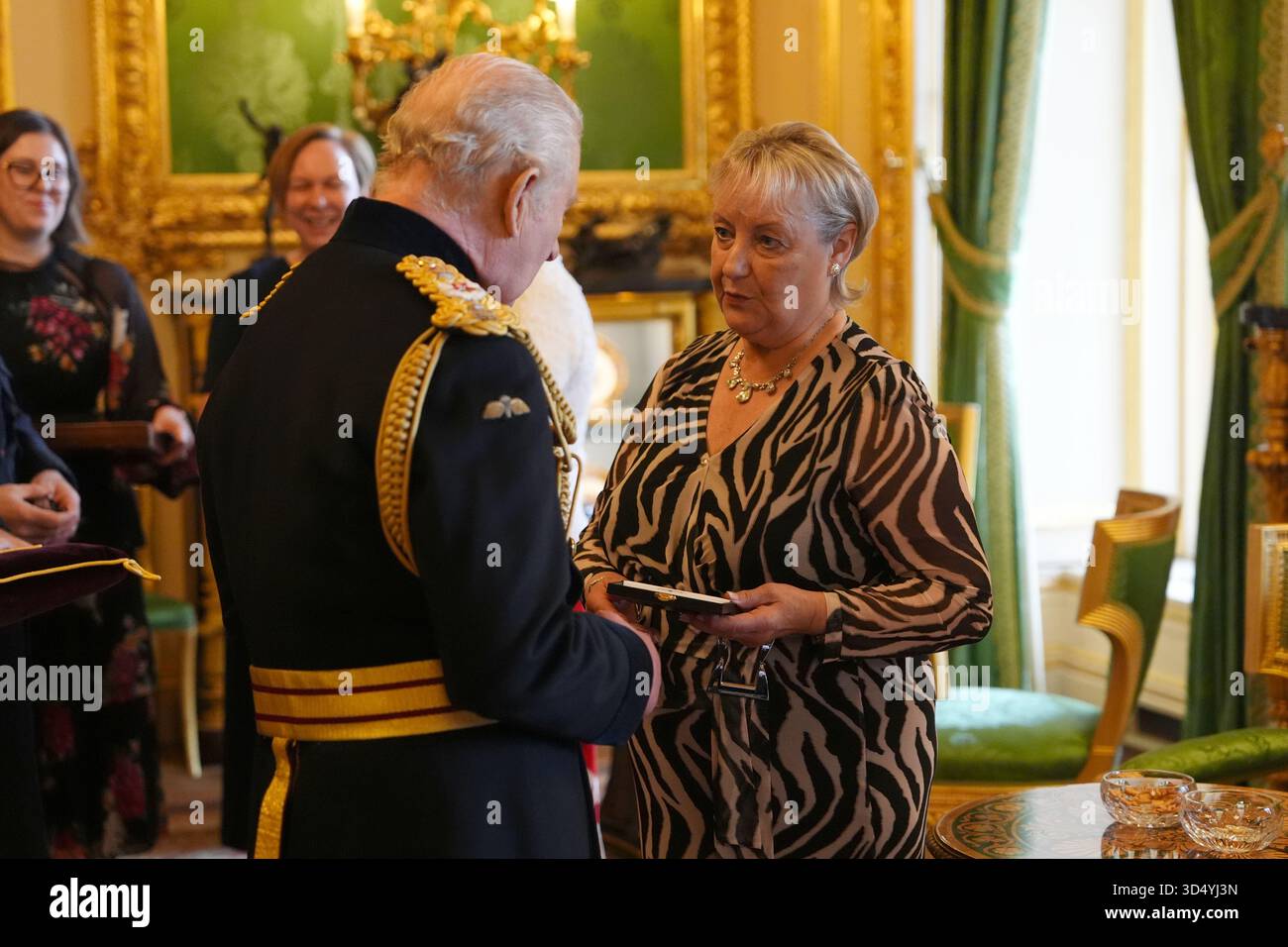 Mrs. Elizabeth Eliott (Widow) receives the Elizabeth Emblem from King ...