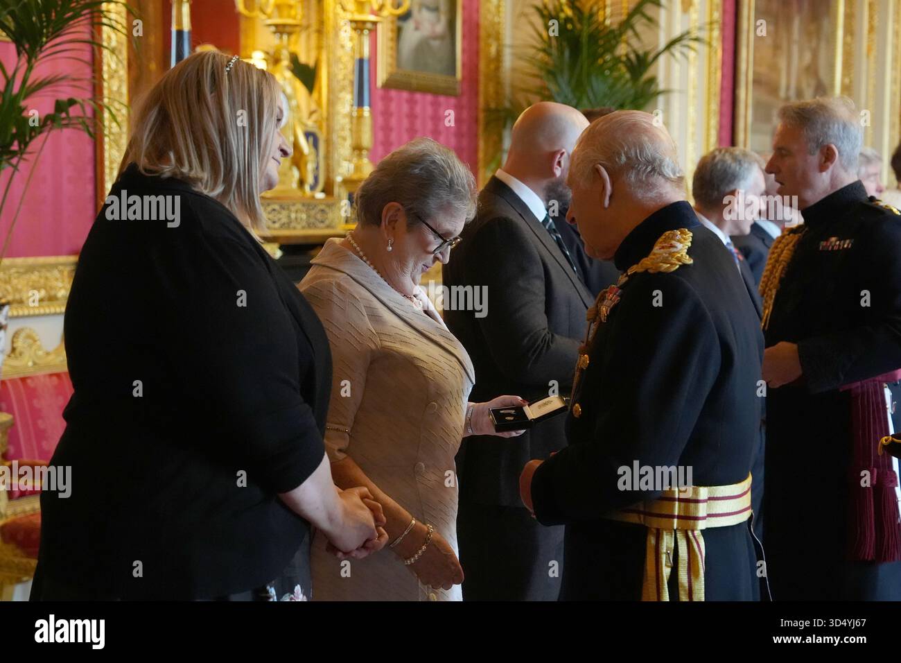Mrs. Thelma Corkey (Widow) receives the Elizabeth Emblem from King ...
