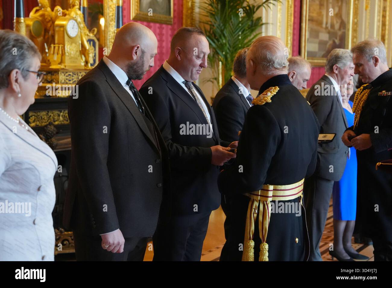 Mr. Philip Martin (Son) receives the Elizabeth Emblem from King Charles ...
