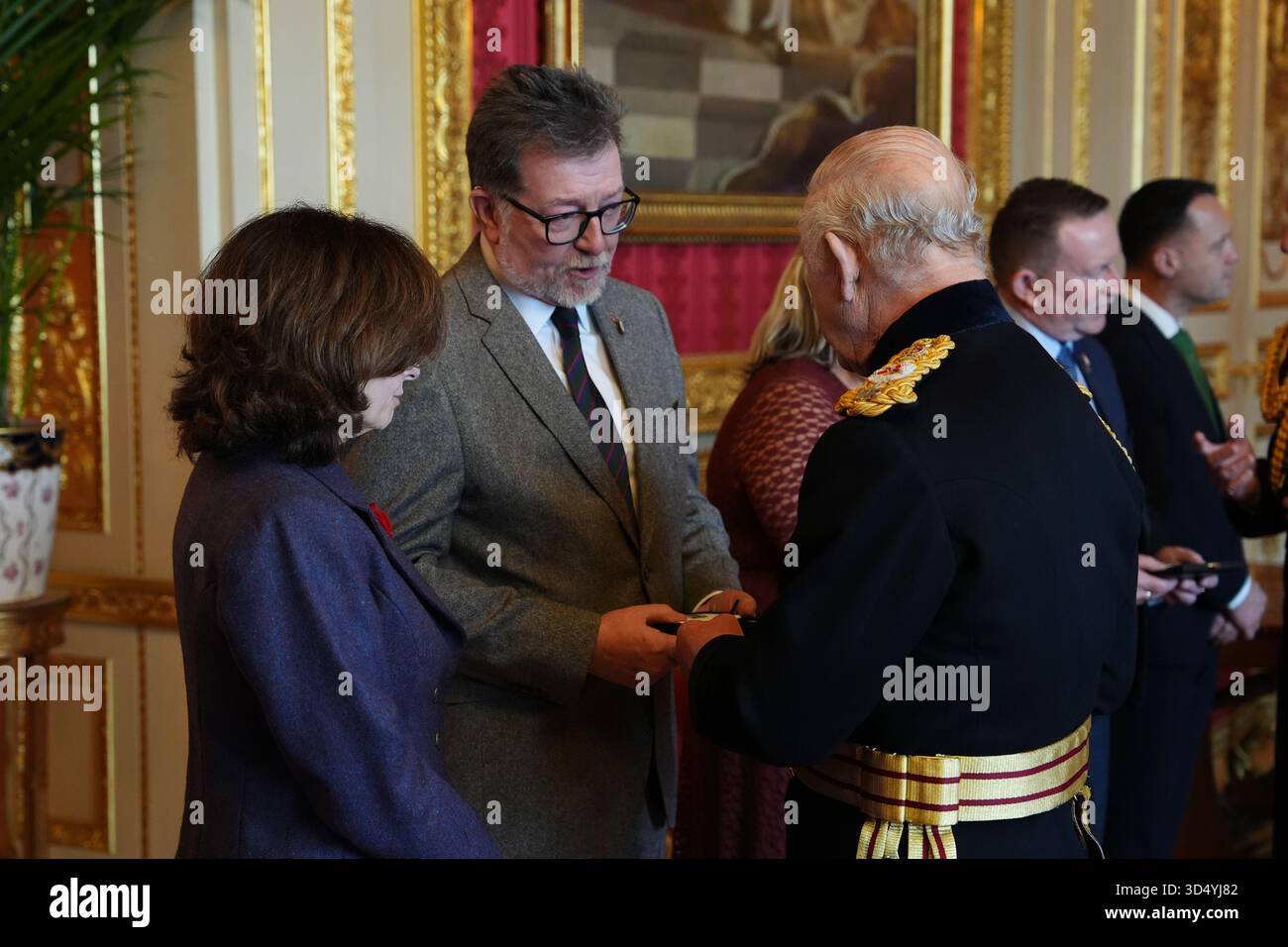 Mr. Kenneth Allen (Son) receives the Elizabeth Emblem from King Charles ...