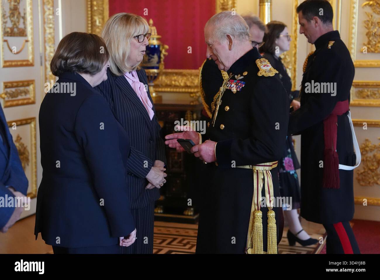 Mrs. Sandra Watson (Sister) receives the Elizabeth Emblem from King ...