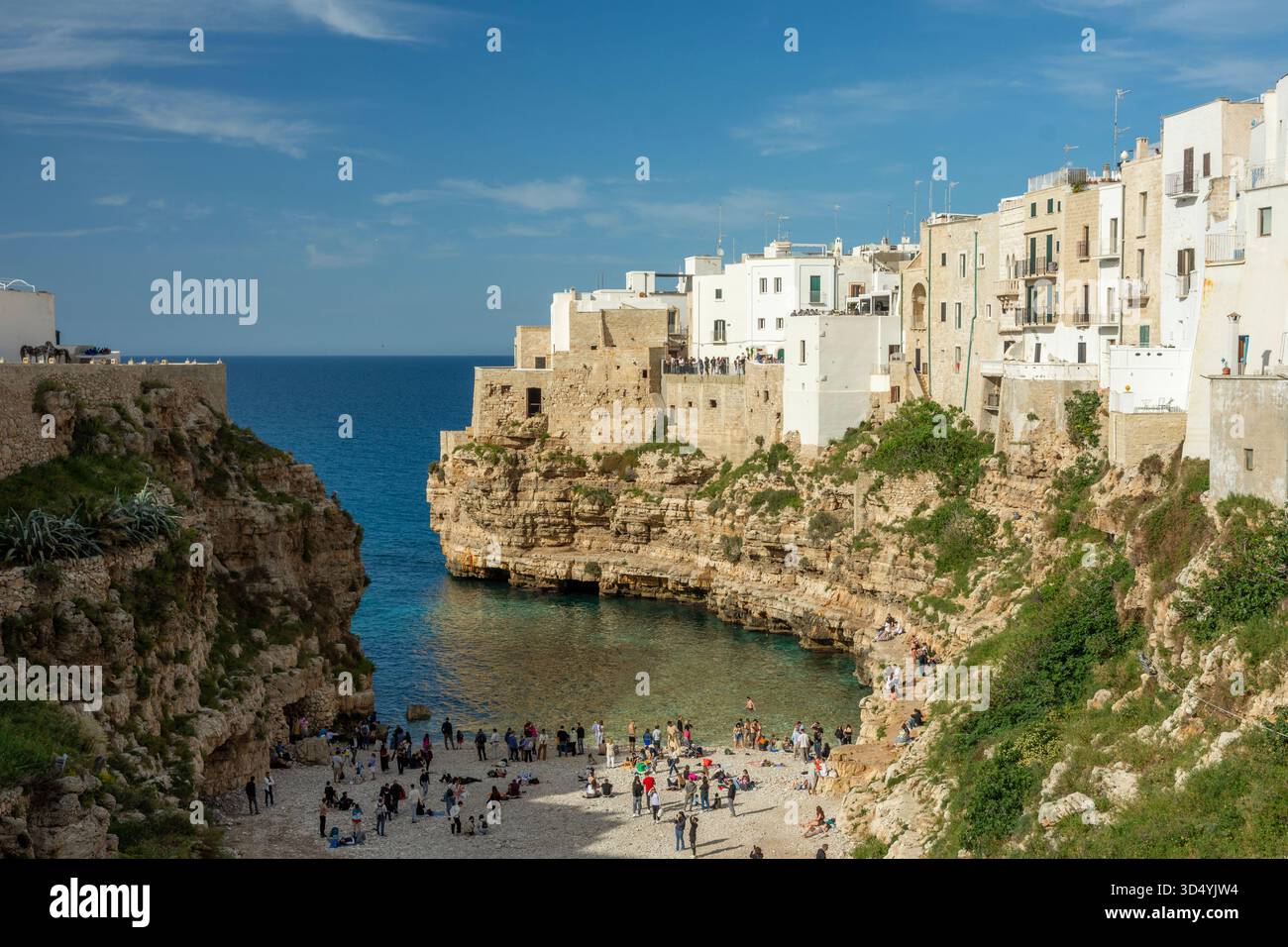 The famous Lama Monachile beach, also known as Cala Porto, in Polignano ...