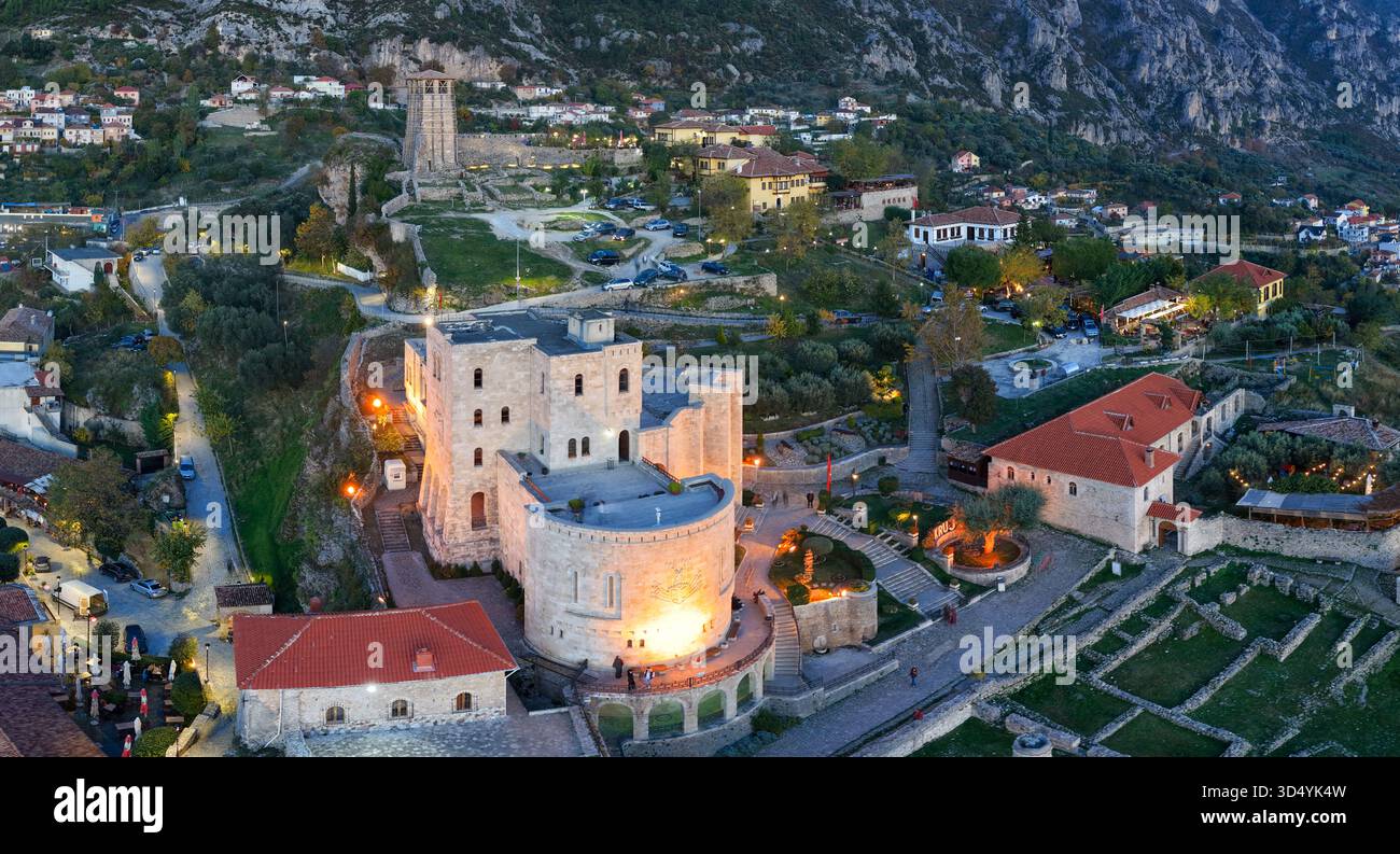 Evening aerial of Krujë Castle with the illuminated Skanderbeg Museum ...