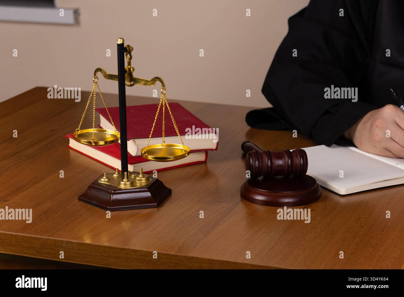 The judge is performing their duties at the desk with the scales Stock ...