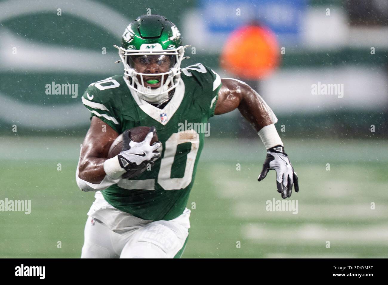 New York Jets running back Breece Hall (20) runs with the ball for a ...