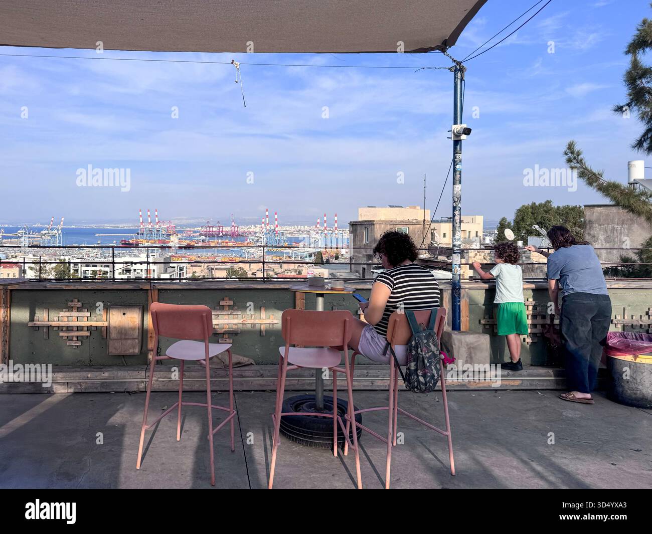 Haifa, Israel, 9 November 2025, A view from a rooftop patio where two ...